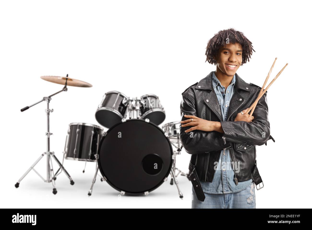 African american male drummer standing in front of a drum kit isolated ...