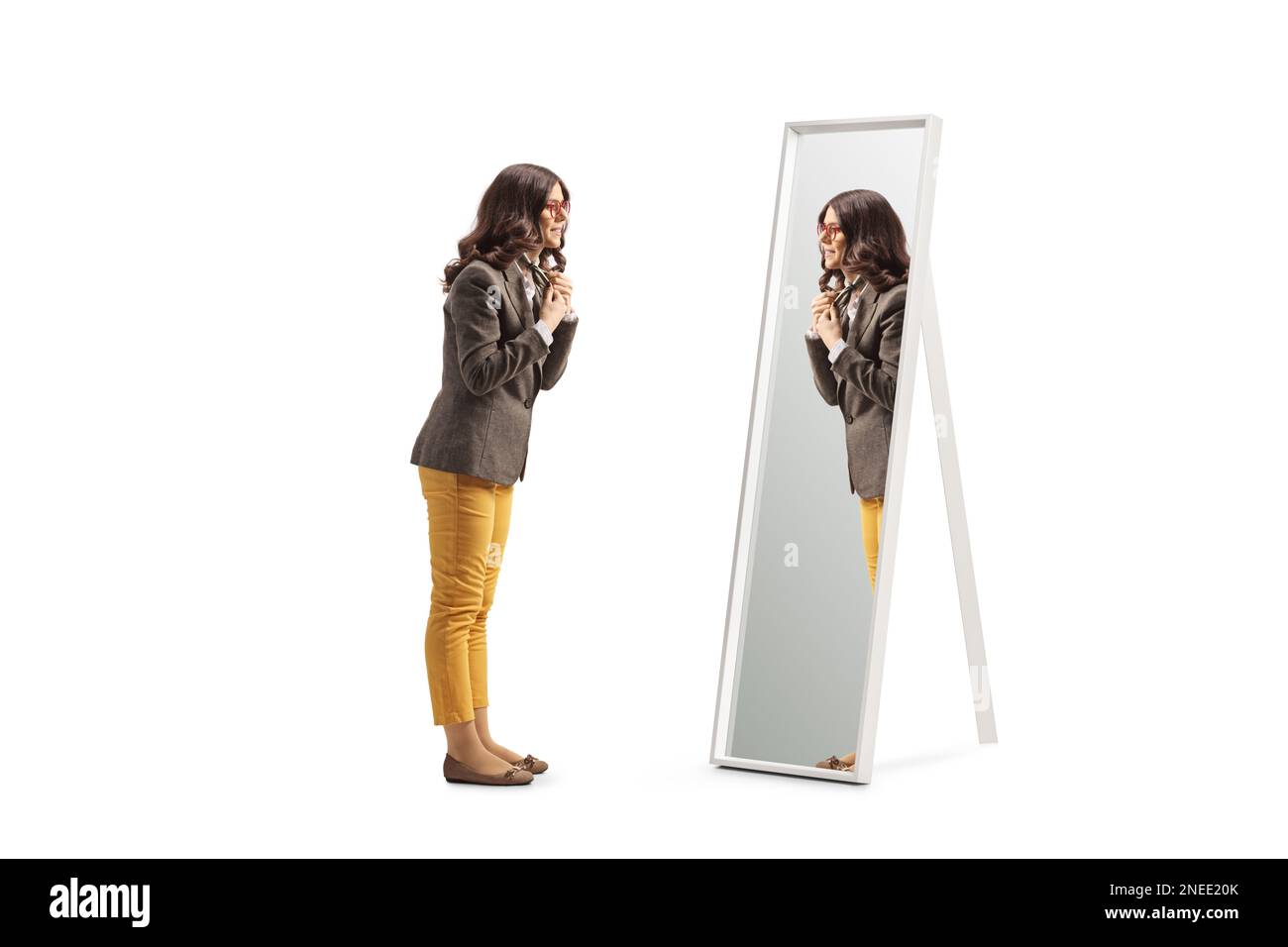Full length profile shot of a young woman getting ready in front of a ...