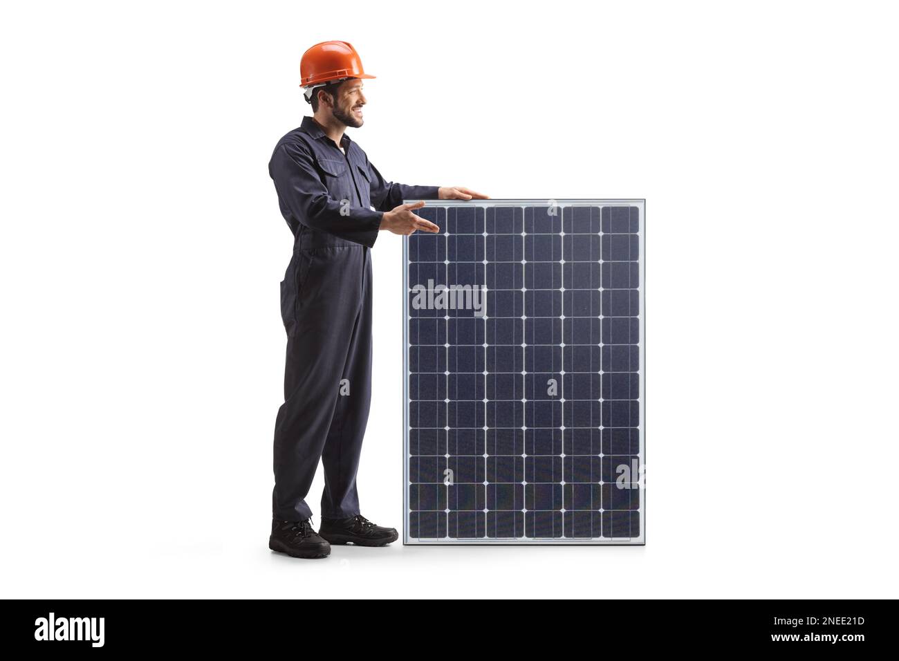 Worker in a uniform and helmet presenting a solar panel isolated on ...
