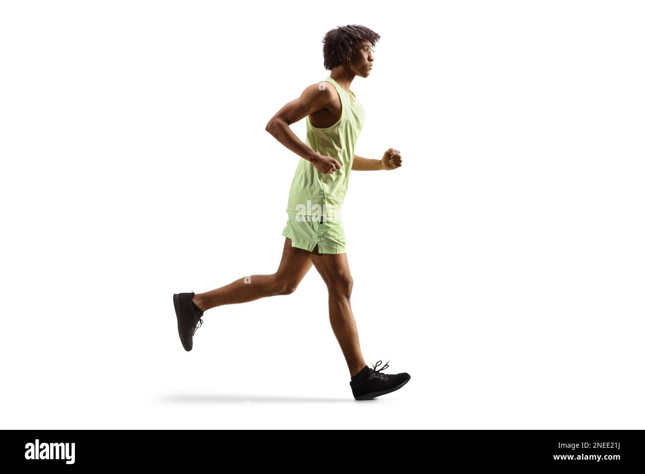 Full length profile shot of an african american guy jogging isolated on ...