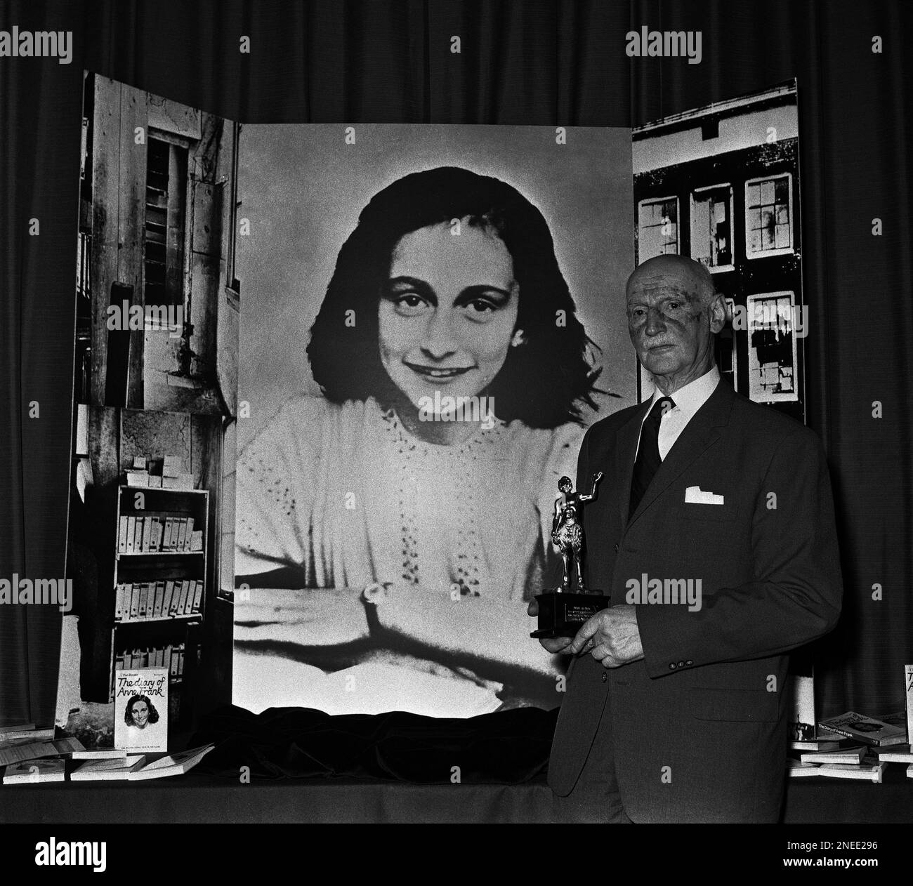 Dr. Otto Frank holds the Golden Pan award, given for the sale of one ...