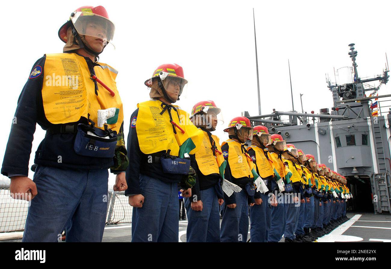 A team of Taiwanese Navy personnel line up on the deck of navy's Cheng ...