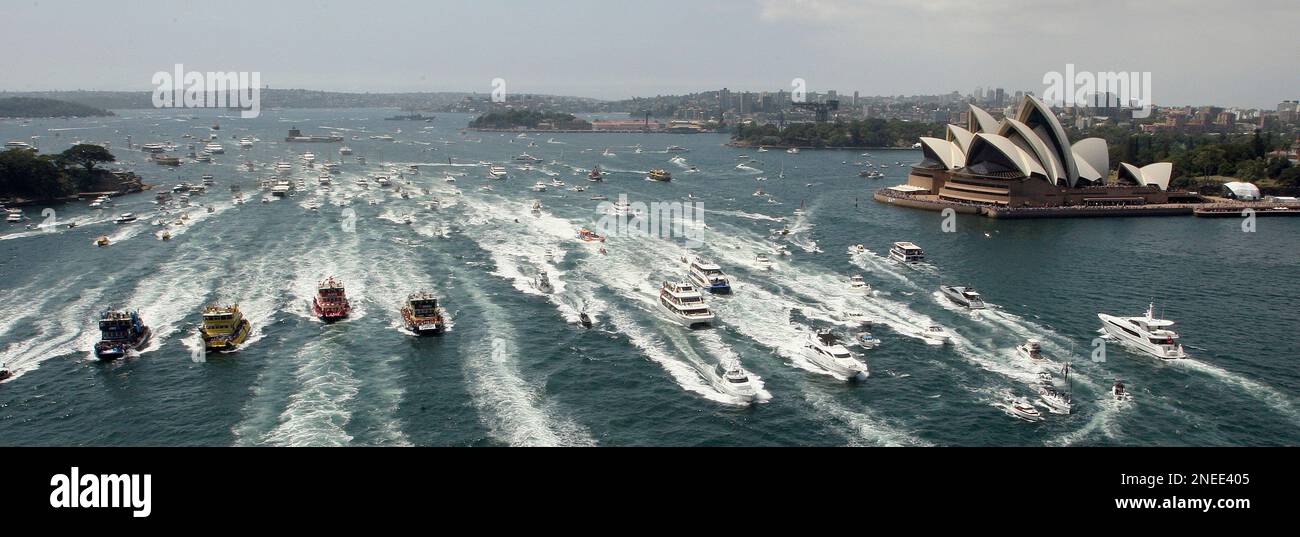 Ferries speed past the Opera House in Sydney, Australia, Tuesday, Jan ...