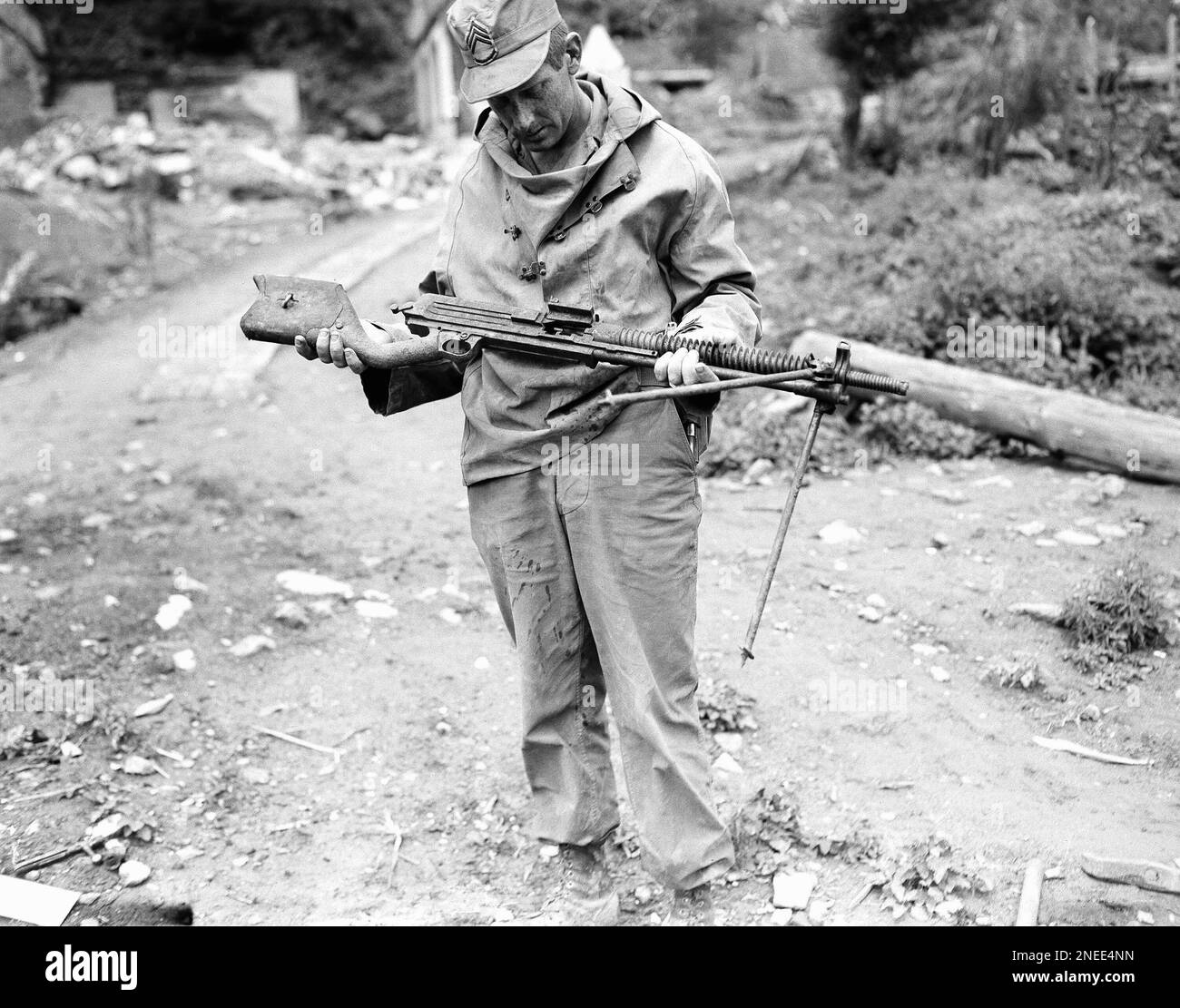 Sgt. Alfred H. Paterson, Minneapolis, Minn., holds an old 25 caliber ...