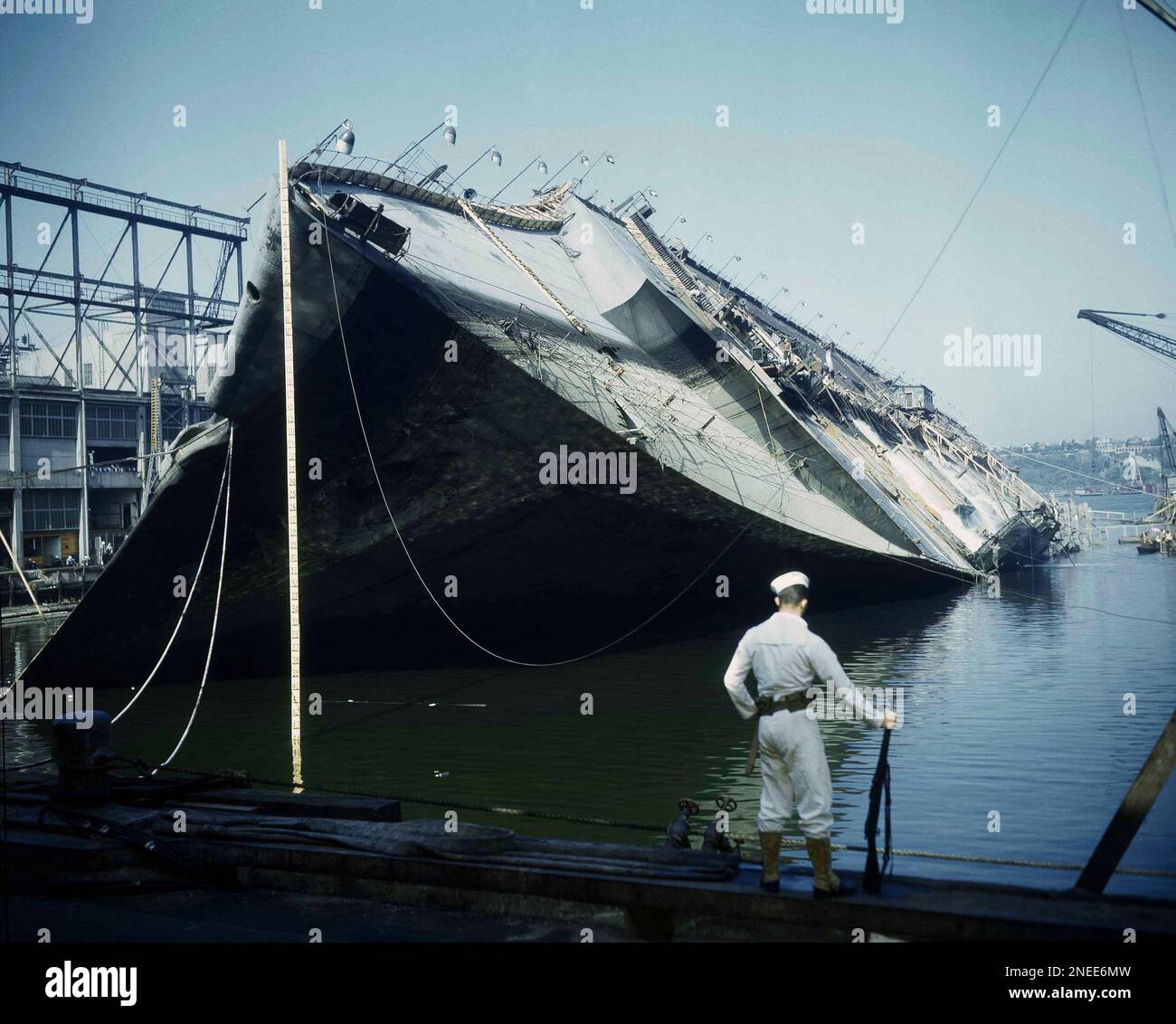 The French liner Normandie lies capsized in the frozen mud in a New ...