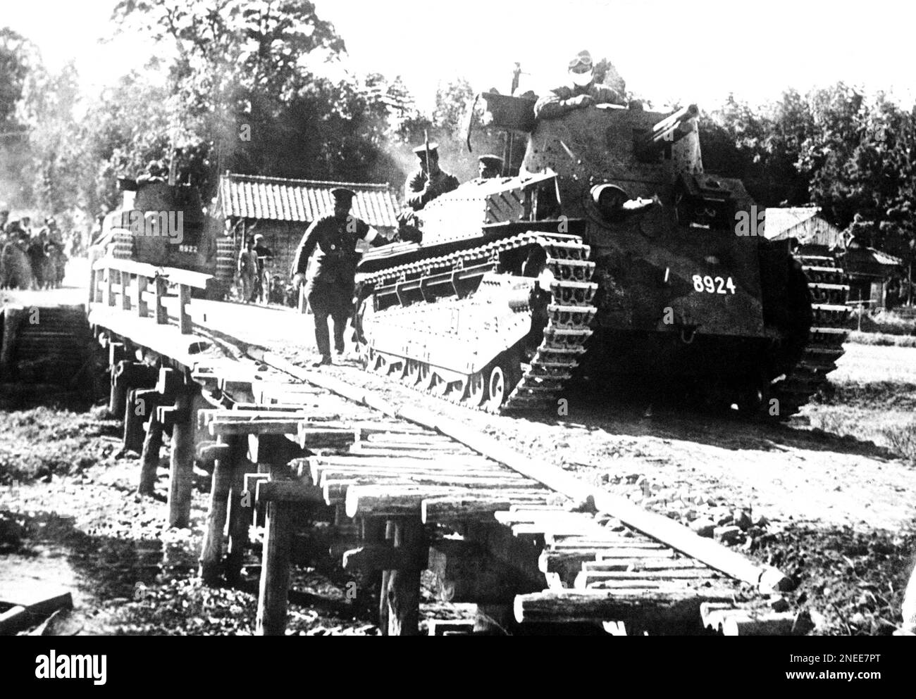 A Japanese tank passing over an emergency bridge, somewhere in China ...