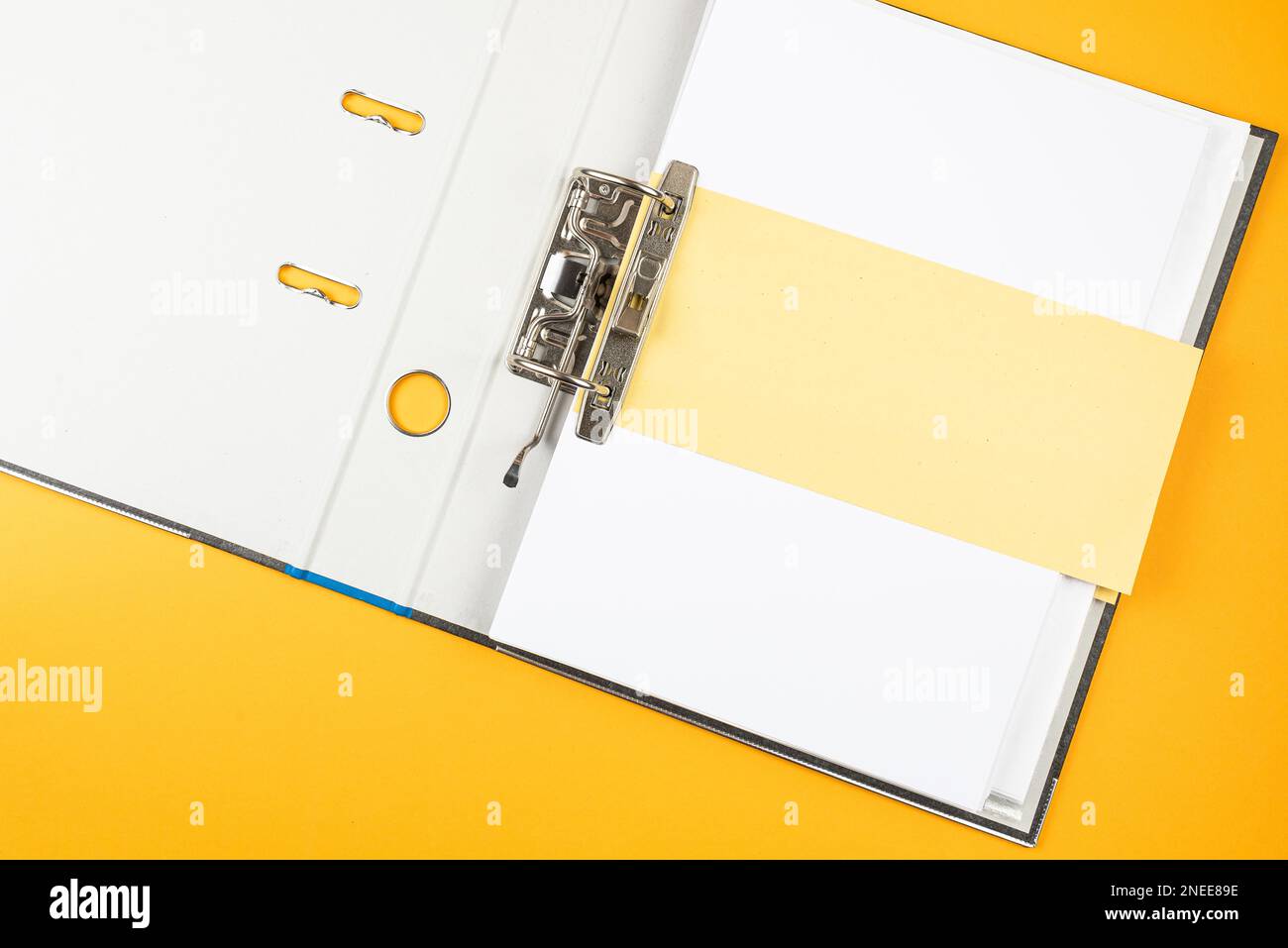 above view of open ring binder, file folder on orange background Stock ...