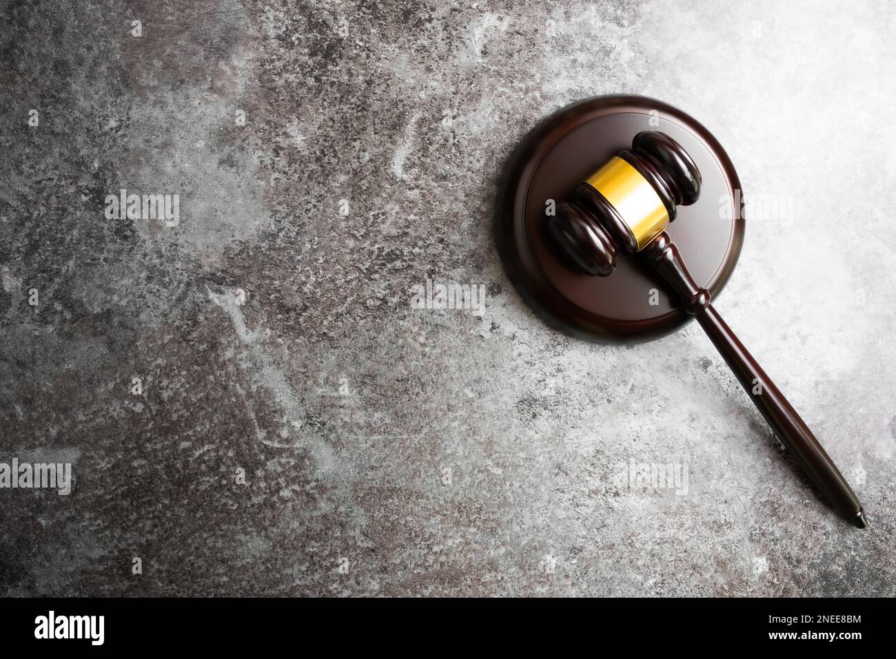 directly above view of judges gavel on marble stone table background ...