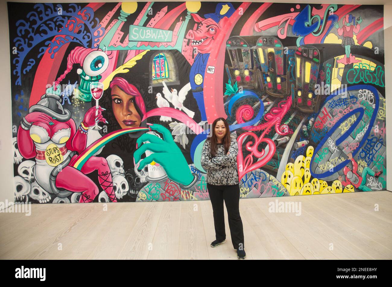 Lady Pink in front of her mural at the Beyond The Streets Exhibition ...