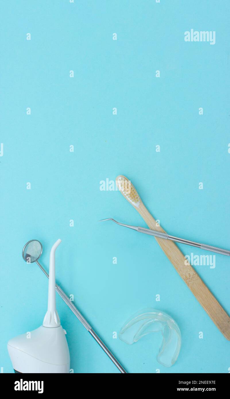 Different tools for dental care, toothbrush, dentist mirror, irrigator ...