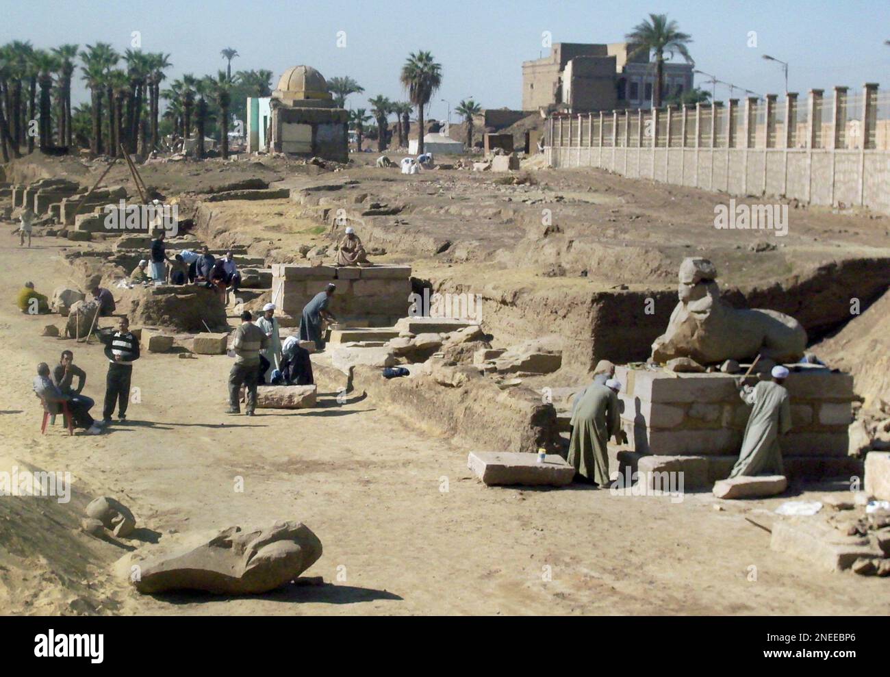 Egyptian workers in Luxor, Egypt, restore the Alley of Sphinxes, Sunday ...