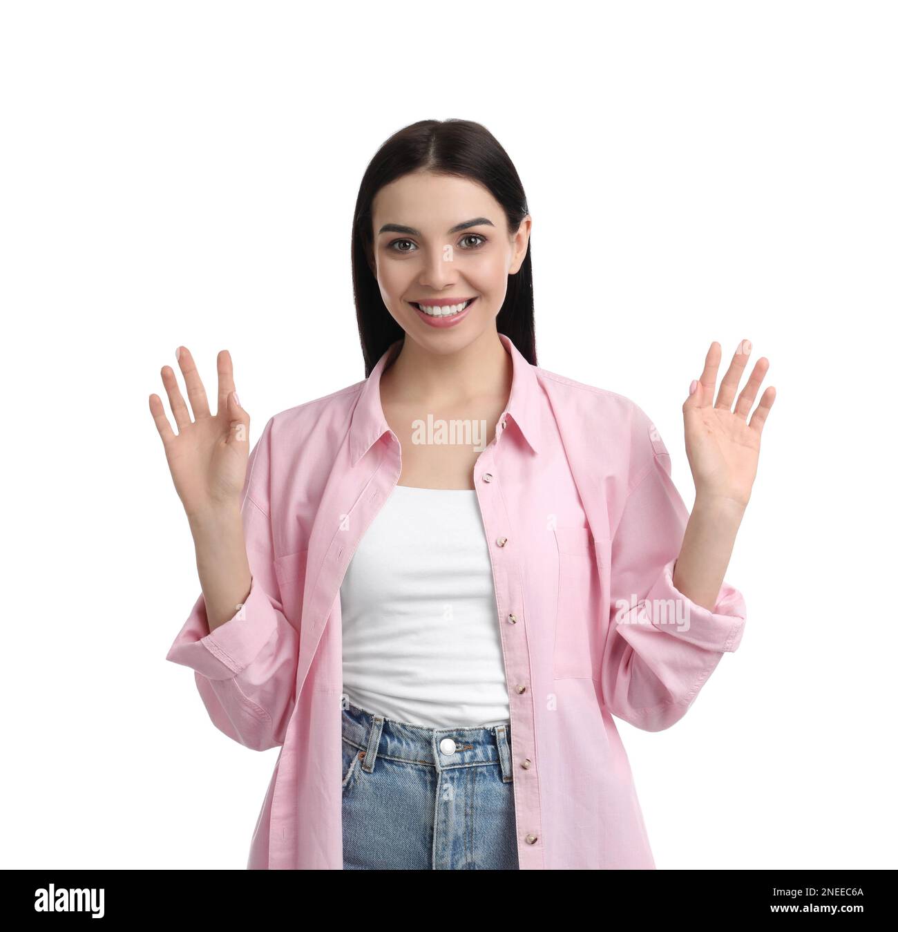 Attractive young woman showing hello gesture on white background Stock ...