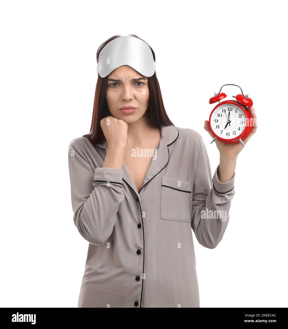 Emotional overslept woman with alarm clock on white background. Being ...