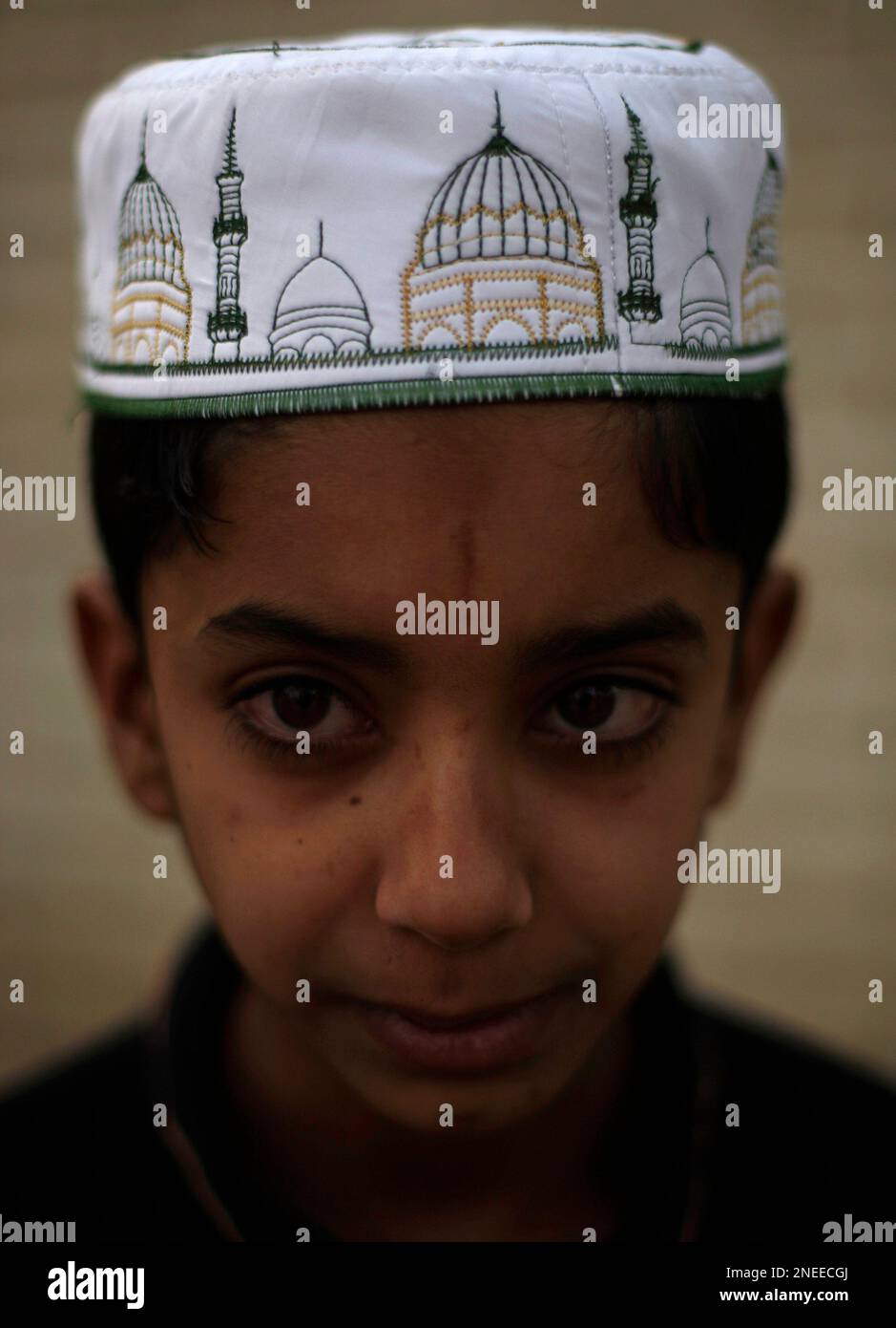 Pakistani Mohammed Omar, 12, is seen, after leaving a mosque in a neighborhood in Islamabad ...
