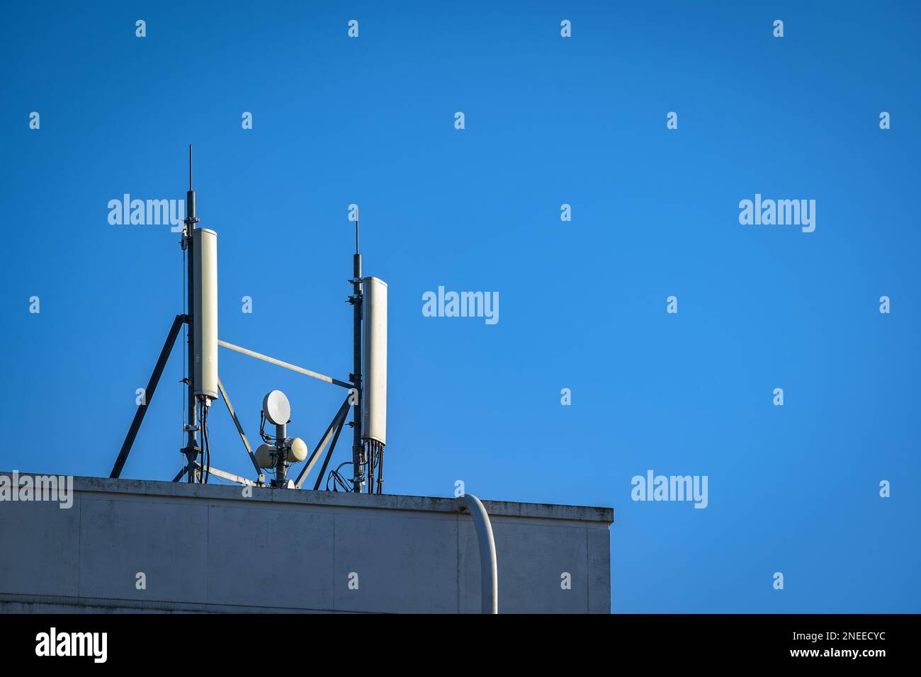 Distant mobile network operator mast in england uk Stock Photo - Alamy