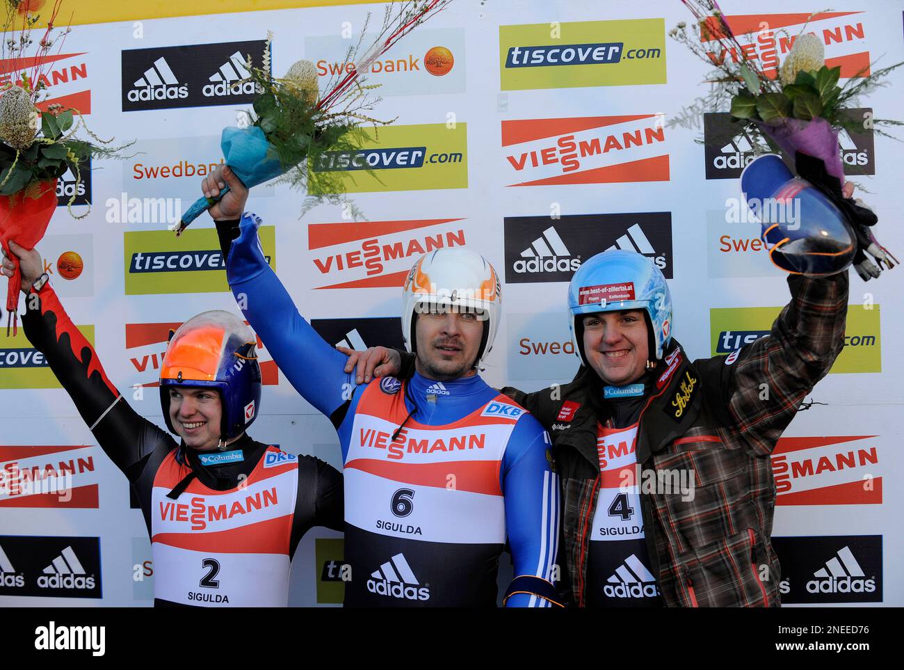 Standing on the podium, from left, Austria's Wolfgang Kindl, second ...