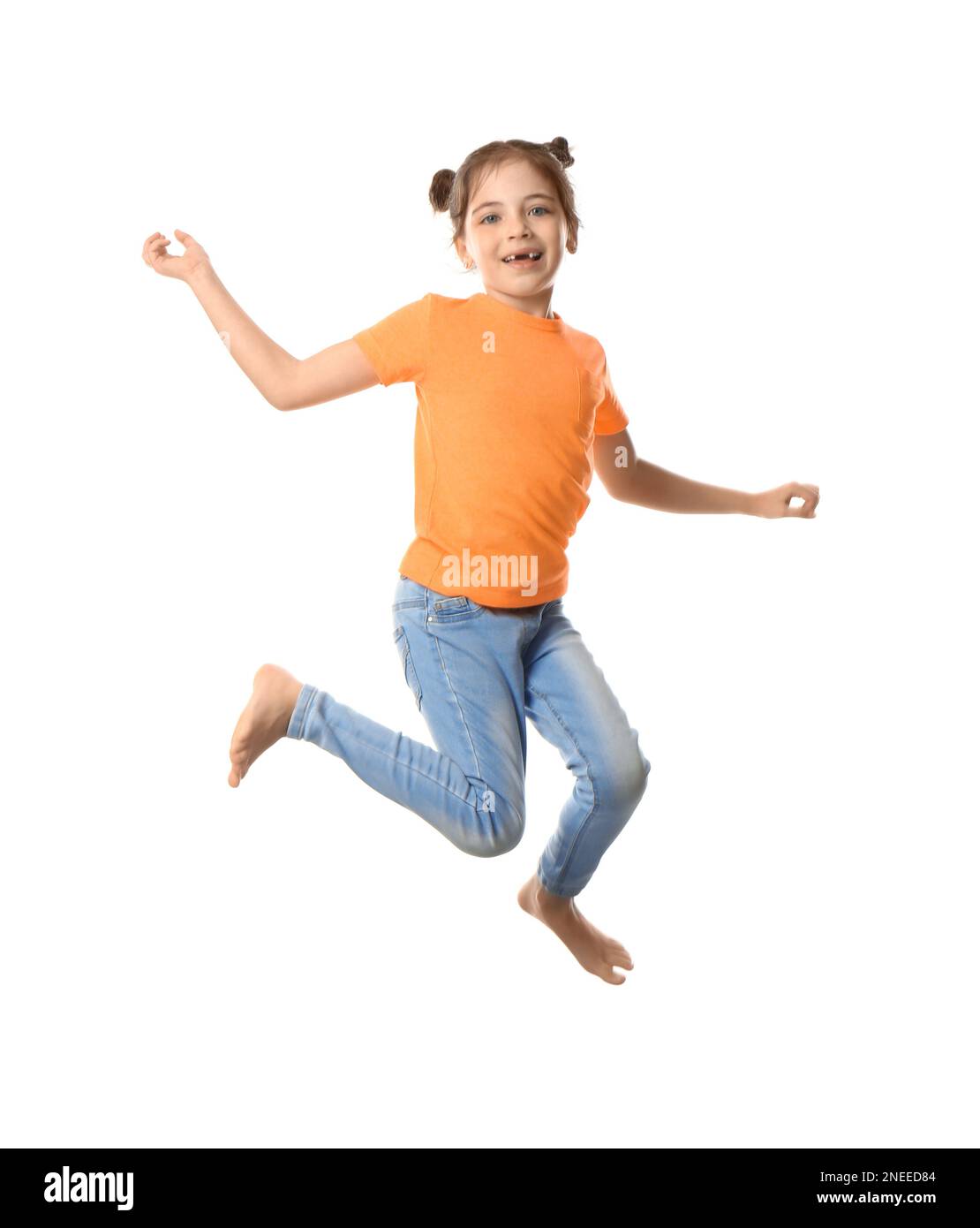 Cute little girl jumping on white background Stock Photo - Alamy