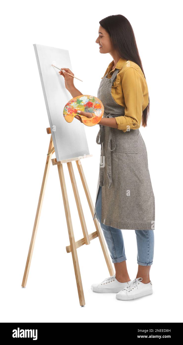 Young woman drawing on easel against white background Stock Photo - Alamy