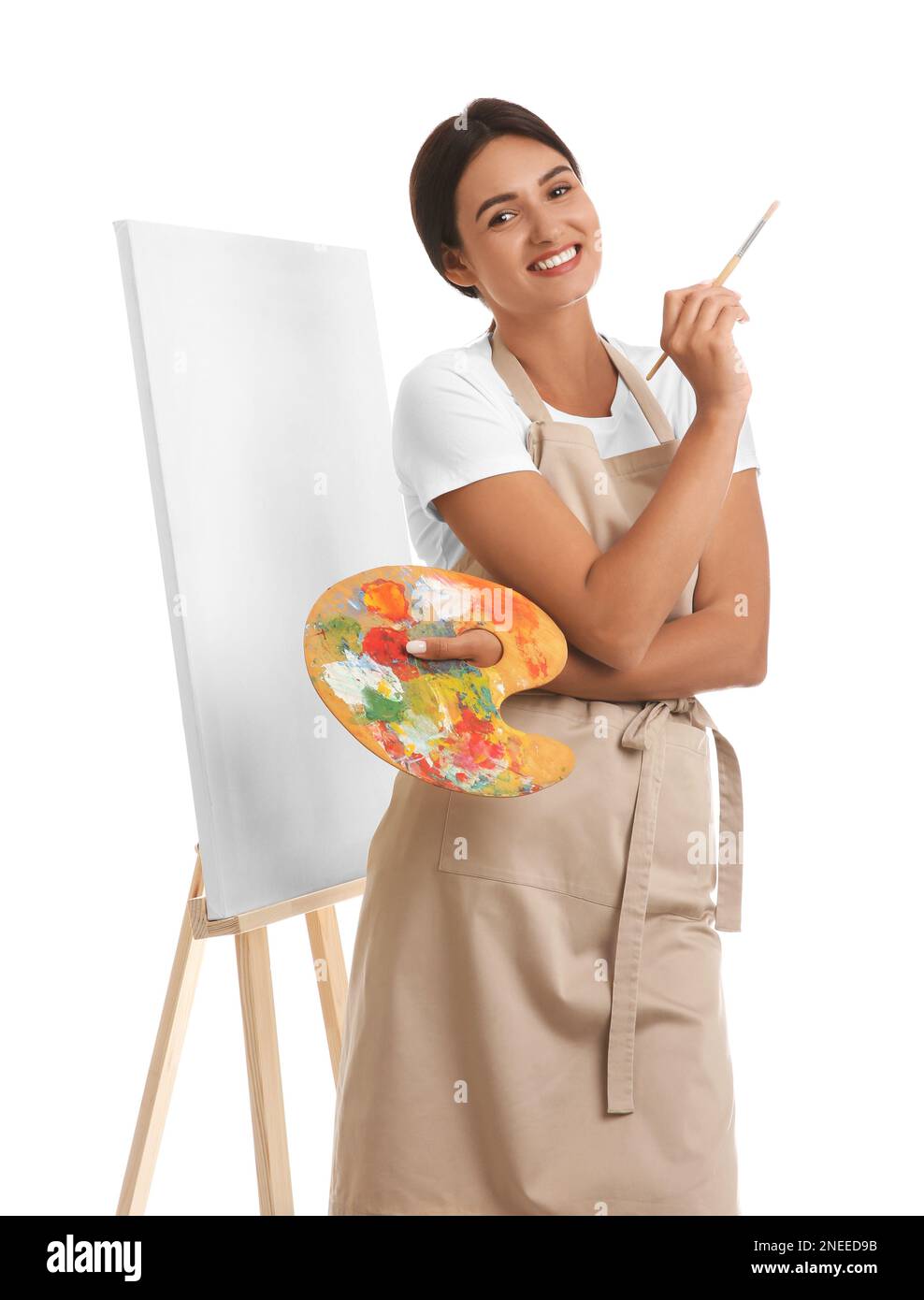Young woman with drawing tools near easel on white background Stock ...