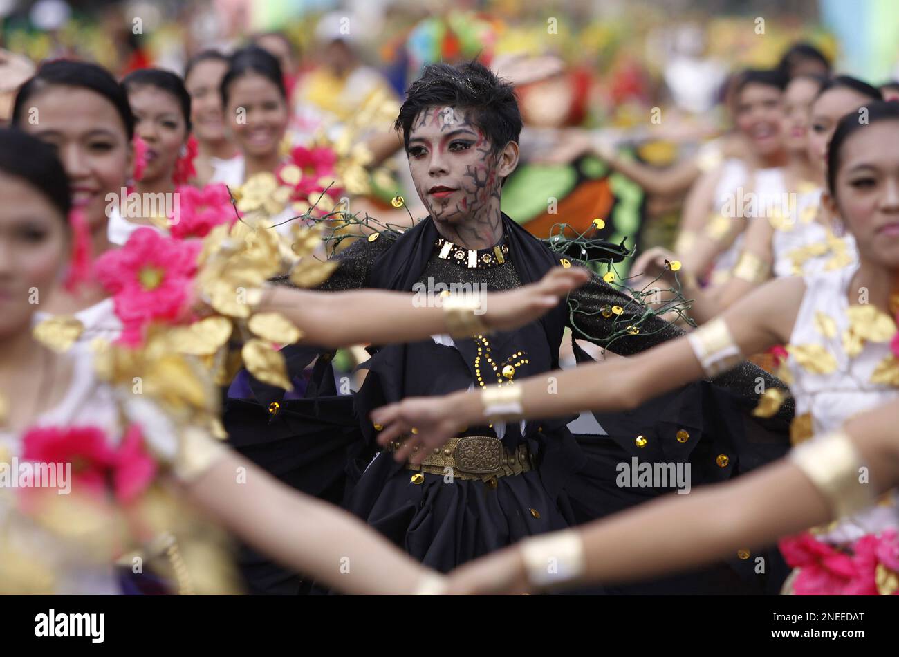 Filipino students dance during the annual "Caracol" festival in Makati ...