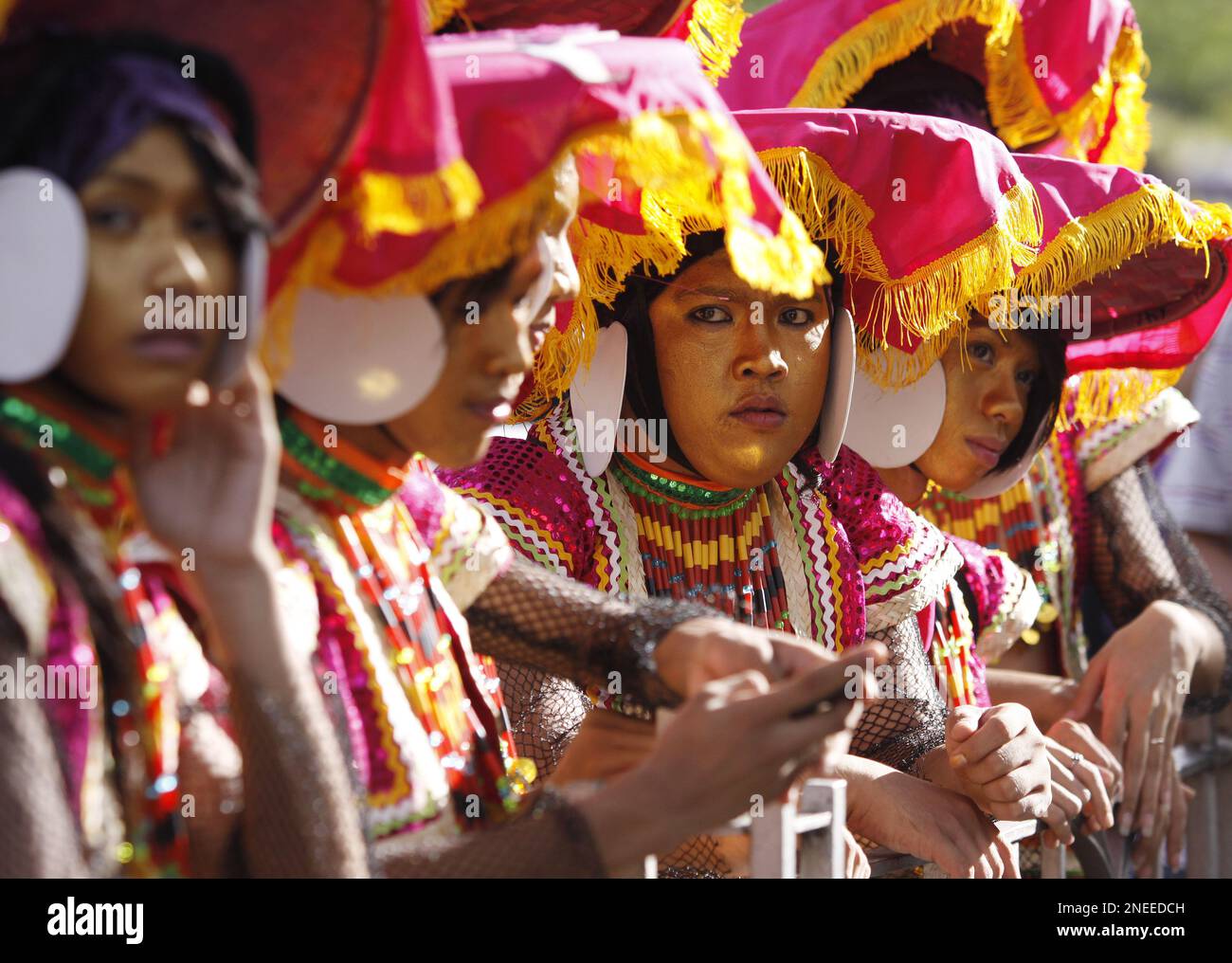 Filipino students wait during the annual "Caracol" festival in Makati ...