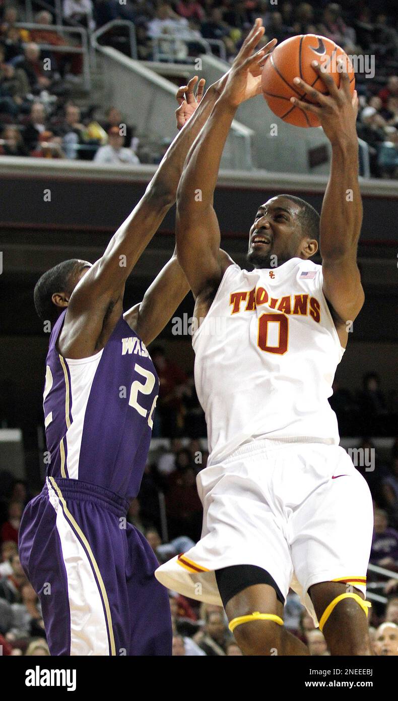 Southern California's Marcus Johnson (0) shoots over Washington's ...