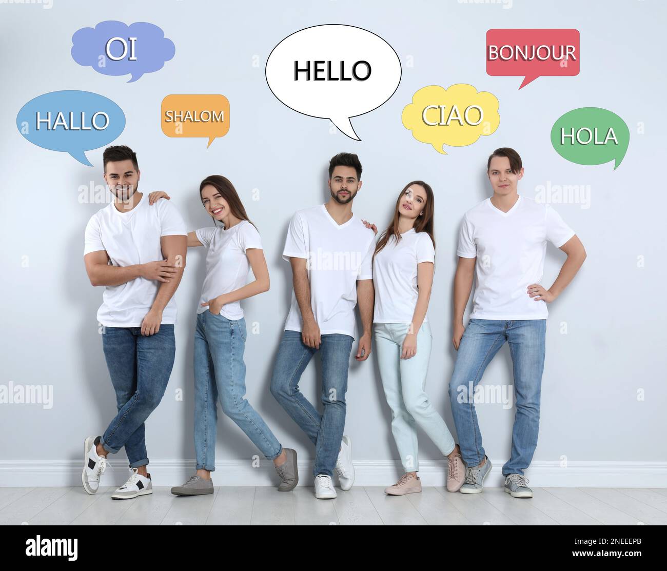Happy people posing near light wall and illustration of speech bubbles ...