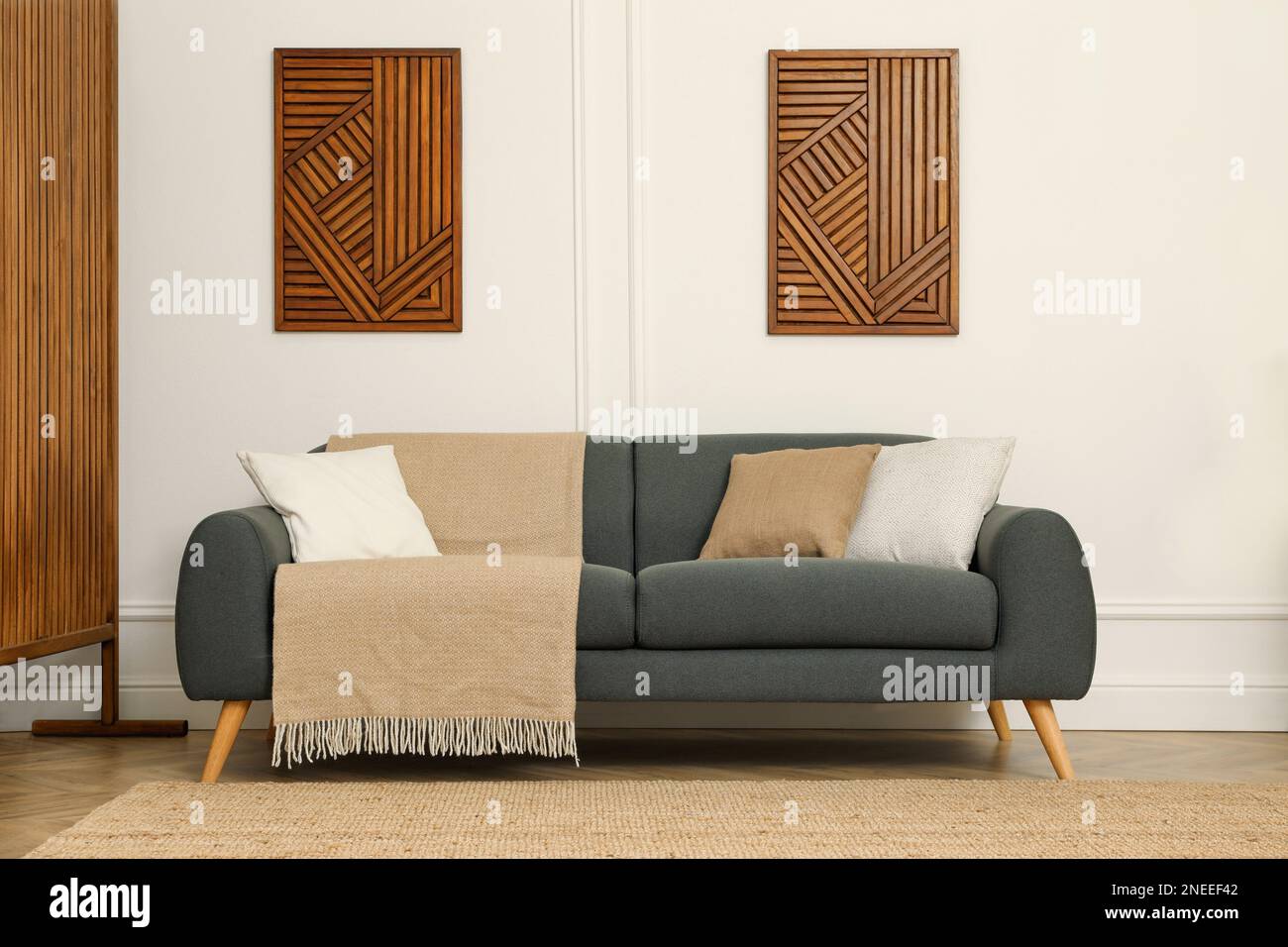 Beautiful sofa with cushions in living room. Interior design Stock ...