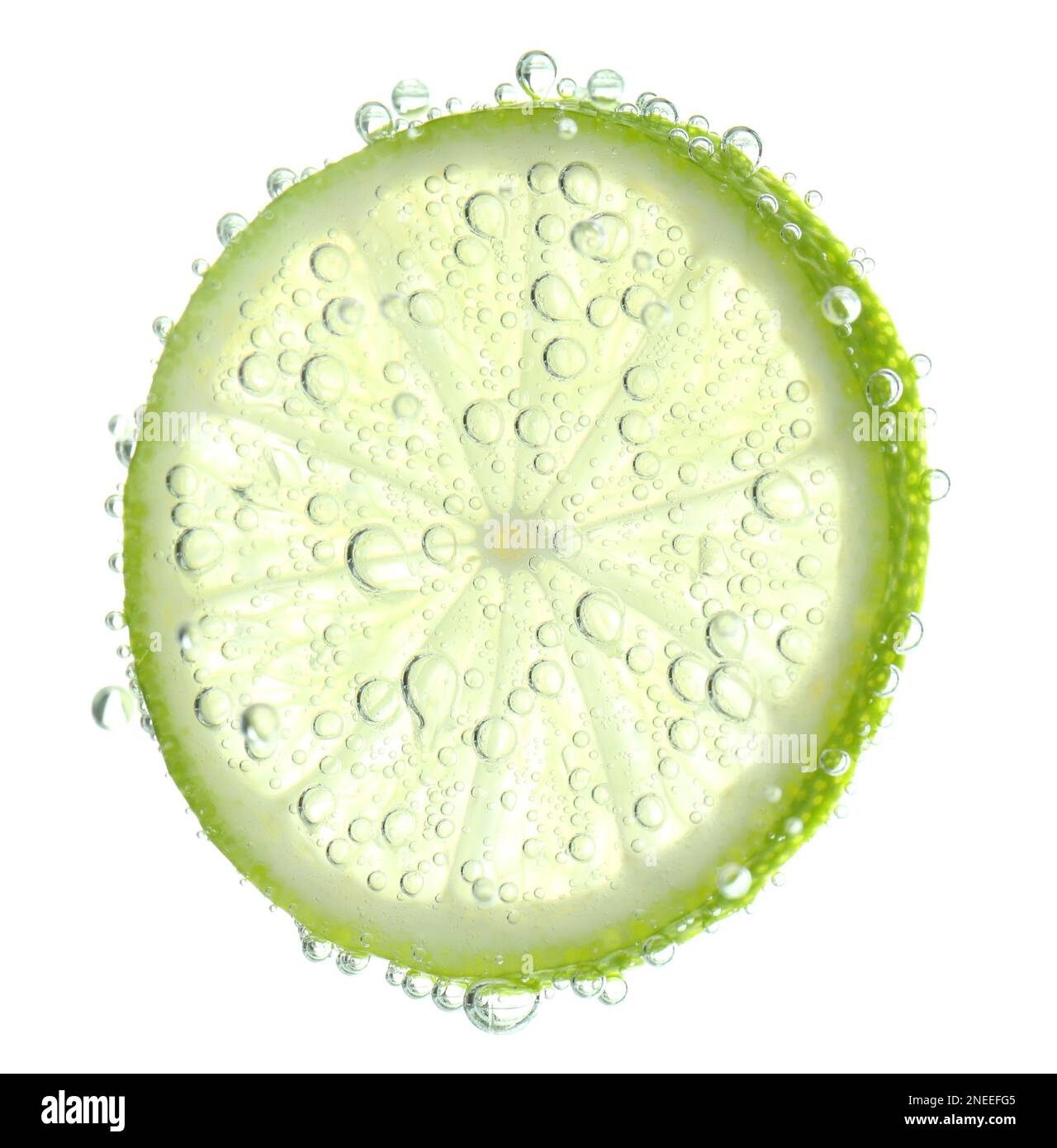 Fresh lime slice in sparkling water on white background Stock Photo - Alamy