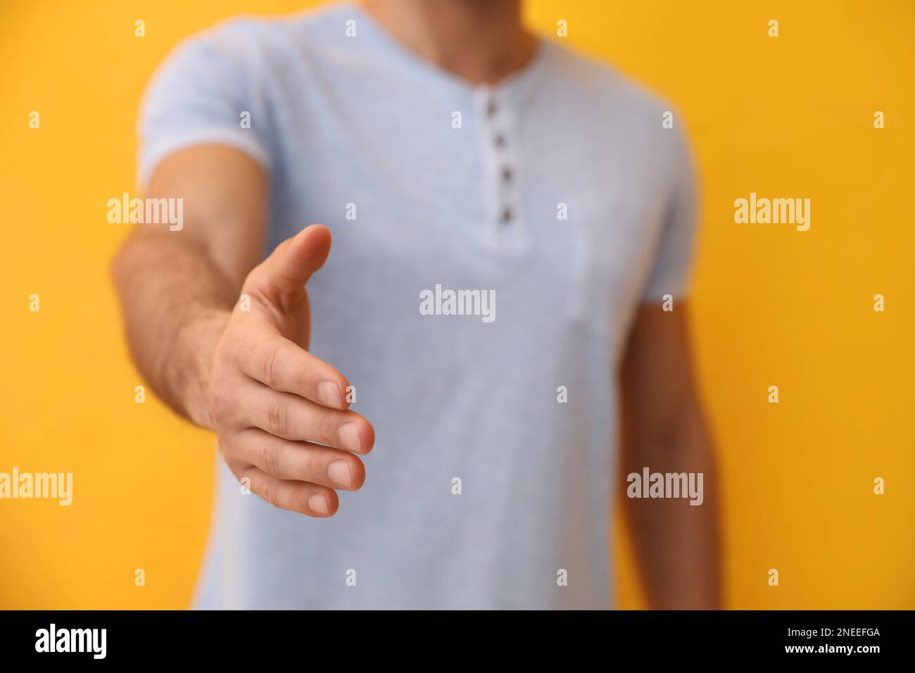 Casual man reaching out hand hi-res stock photography and images - Alamy