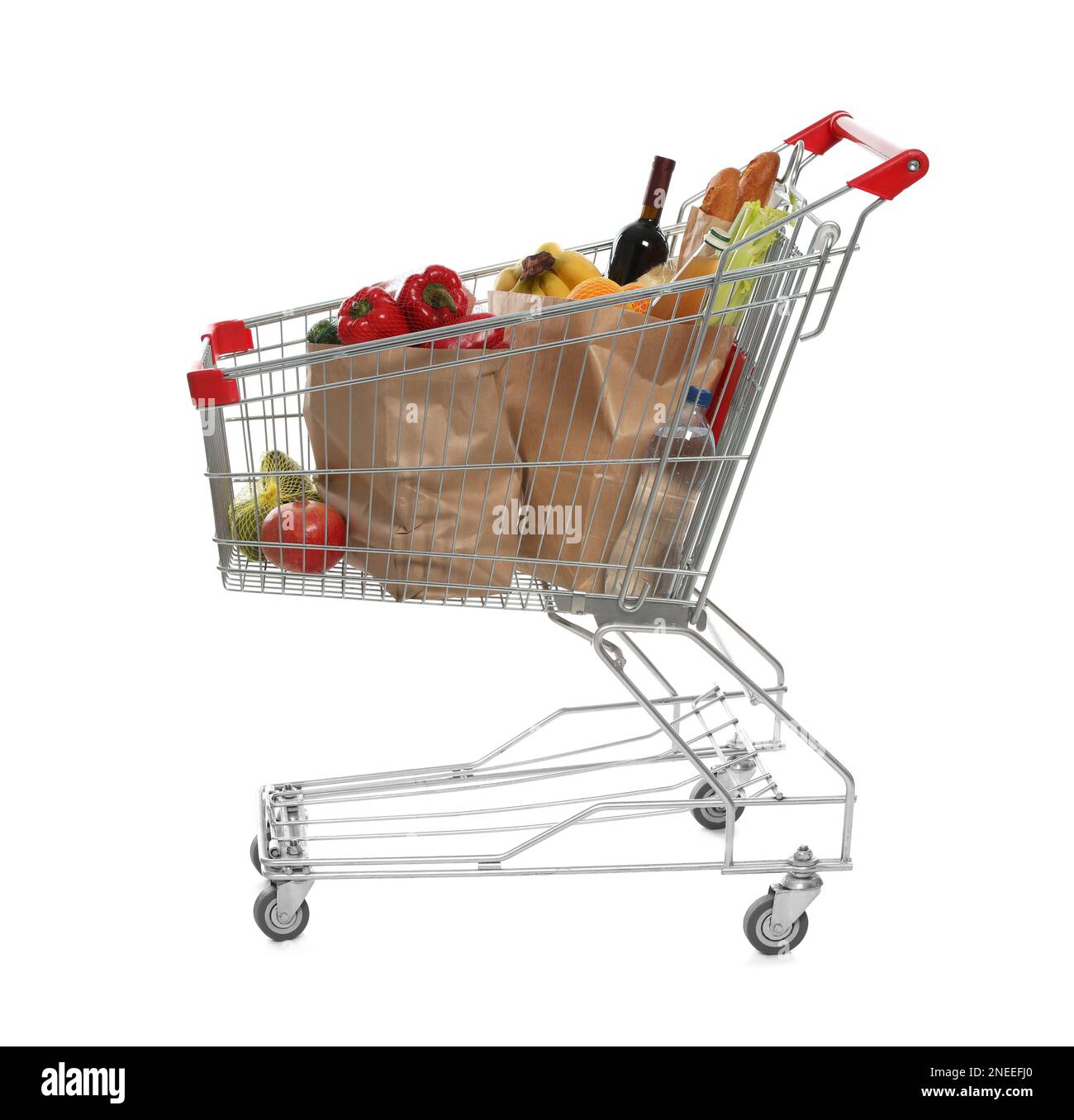 Shopping cart full of groceries on white background Stock Photo - Alamy