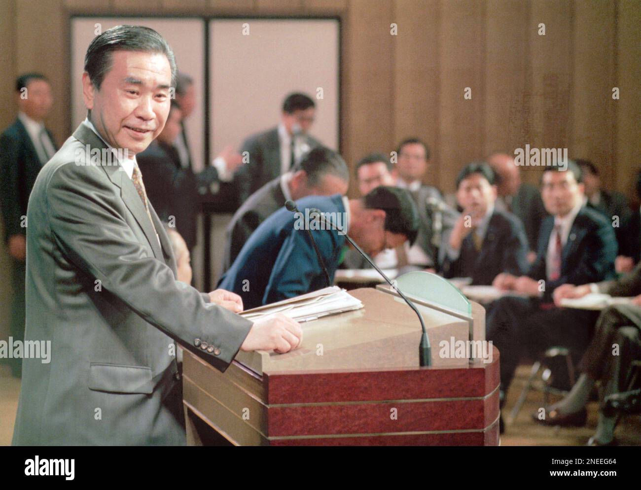 Japan's new Prime Minister Tsutomu Hata smiles at photographars before the start of his first ...