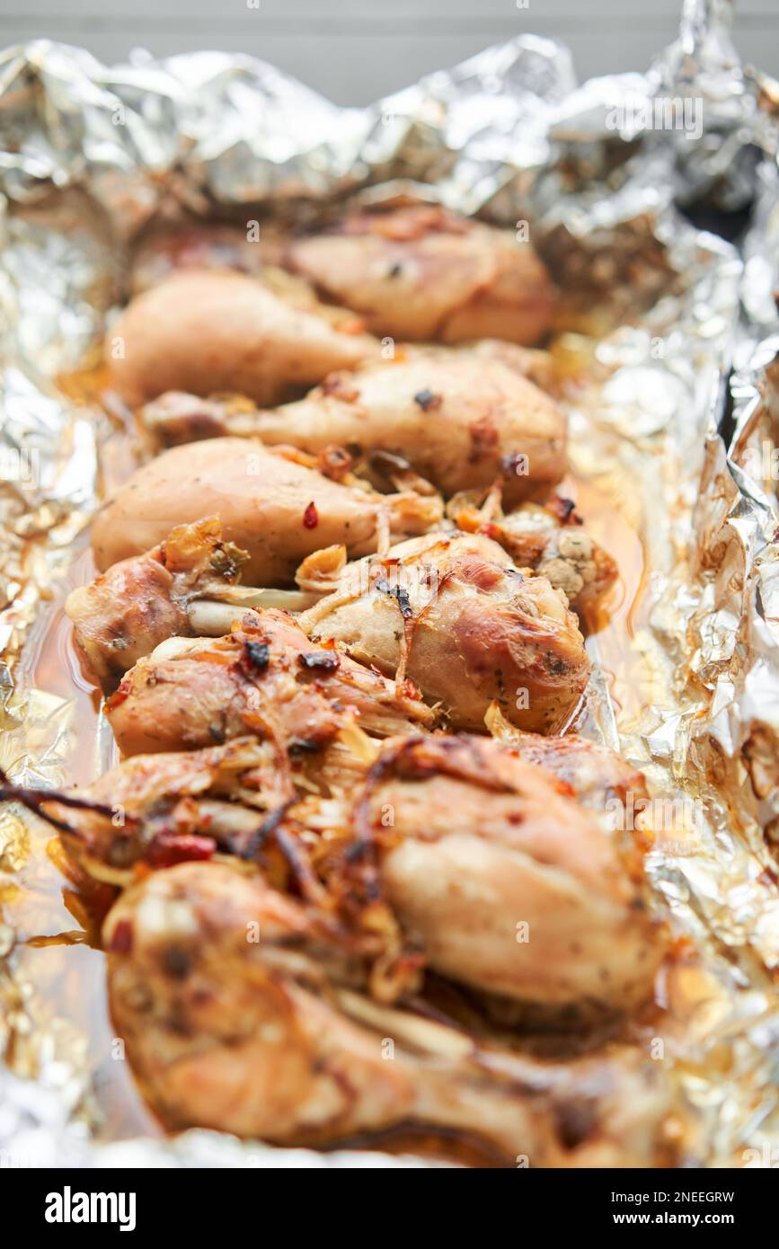 Baked chicken drumsticks without skin. Baked in foil with onions and ...
