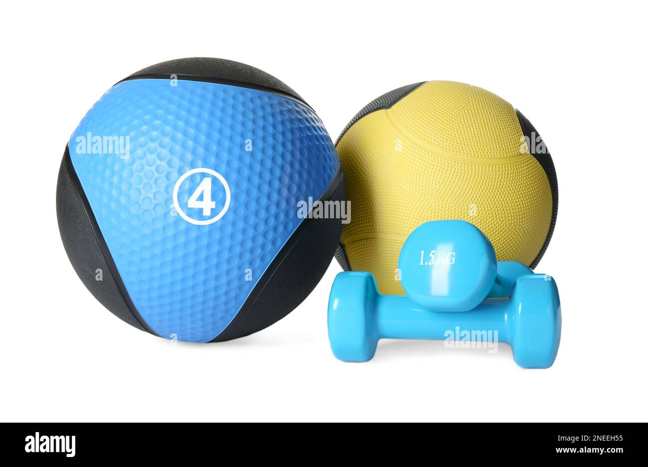 Medicine balls and dumbbells on white background Stock Photo - Alamy