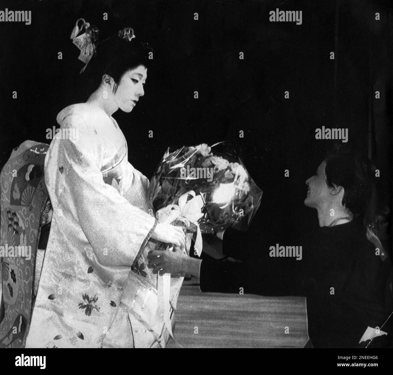 Bando Tamasaburo accepts flowers from Isabellla Rossellini, daughter of ...