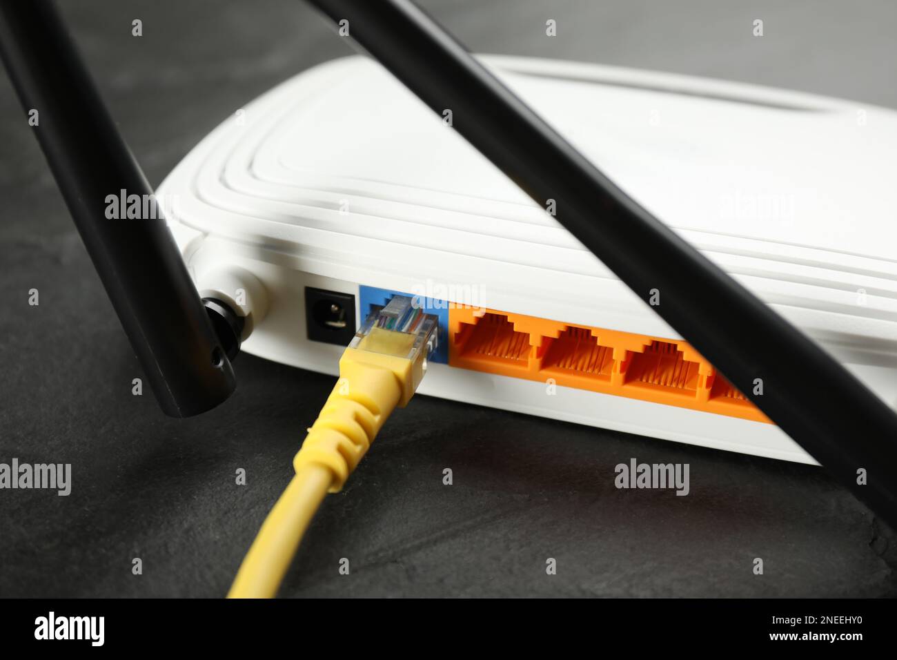 Modern Wi-Fi router on black table, closeup Stock Photo - Alamy