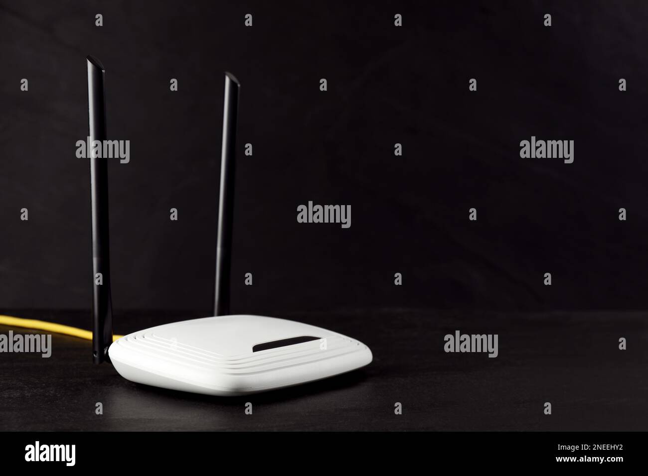 Modern wireless Wi-Fi router on black background. Space for text Stock ...