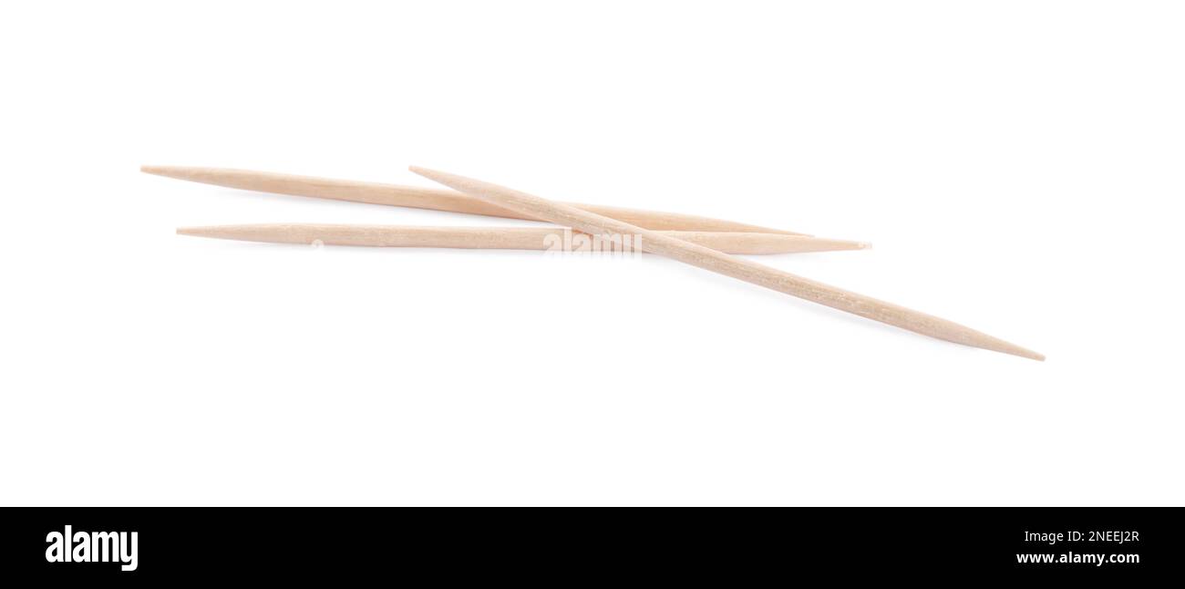 Three disposable wooden toothpicks on white background Stock Photo - Alamy