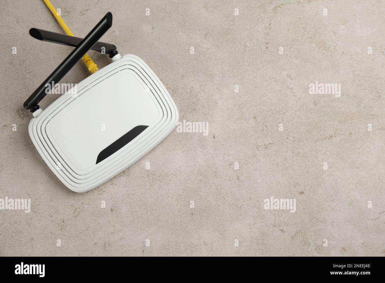 Modern Wi-Fi router on light background, top view. Space for text Stock ...