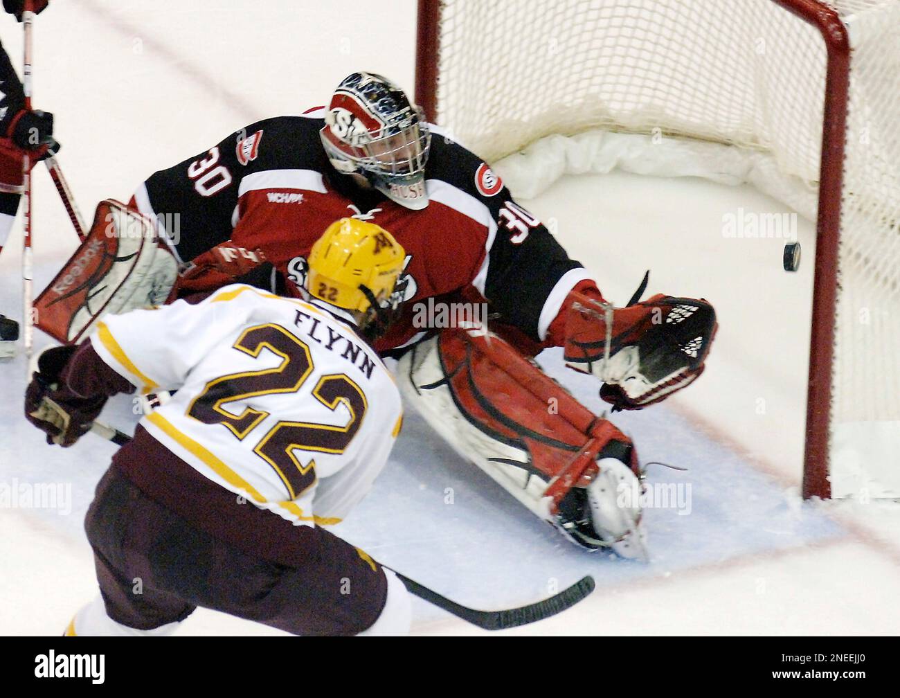 St. Cloud State goalie Mike Lee makes a save against Minnesota's Ryan ...