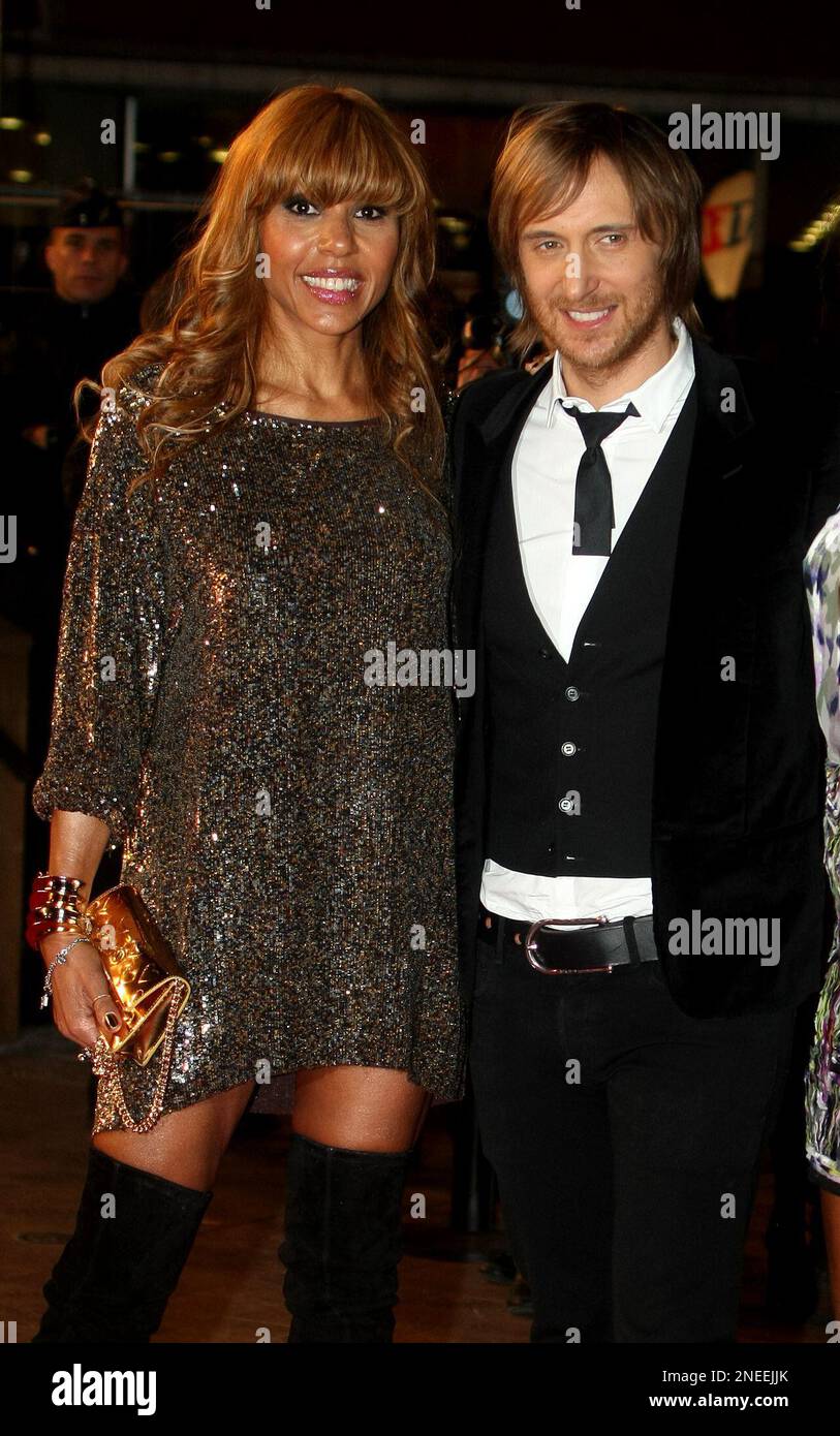 French house producer and DJ David Guetta with his wife Cathy arrive at ...