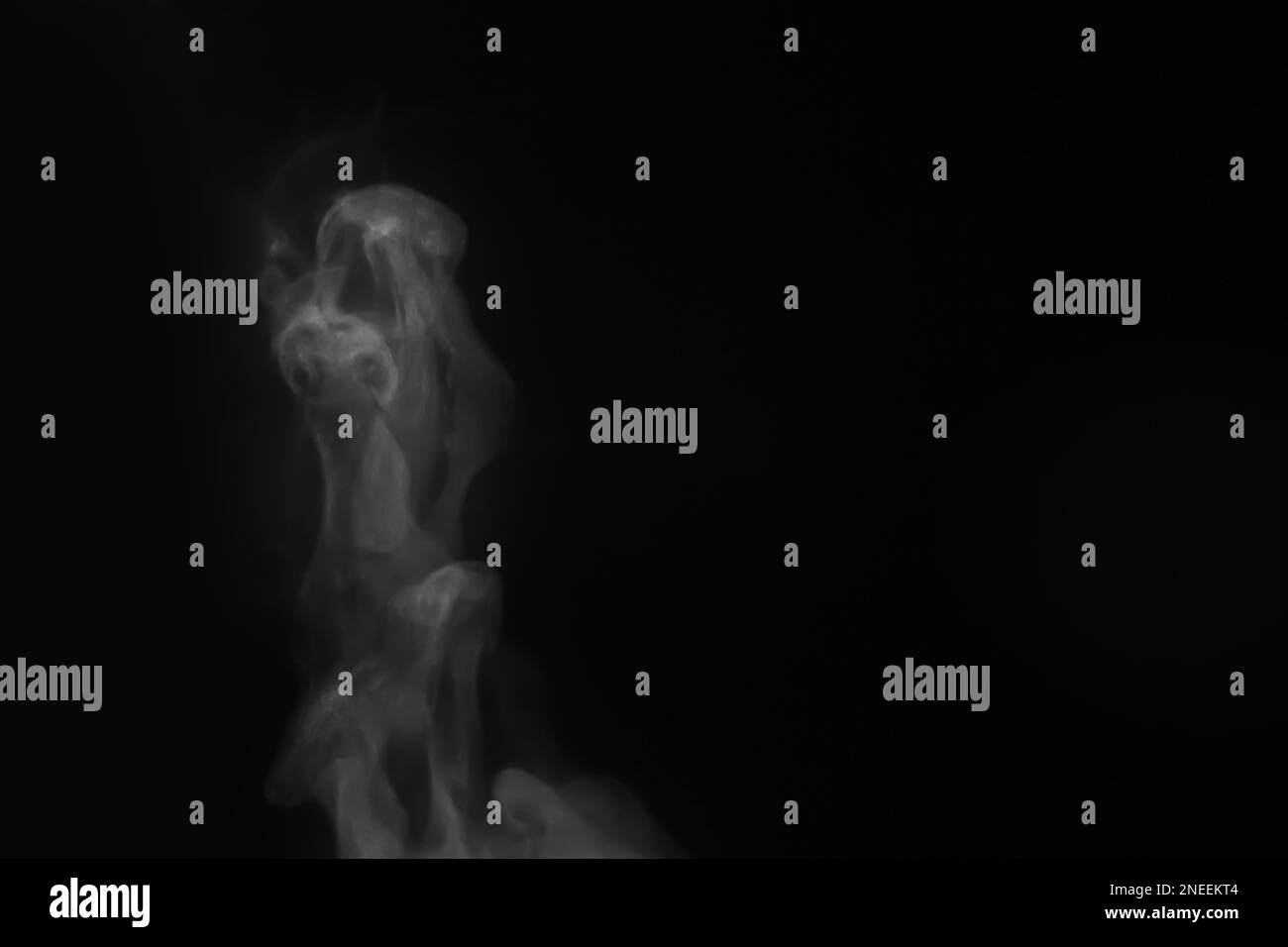 White steam in air against black background Stock Photo - Alamy