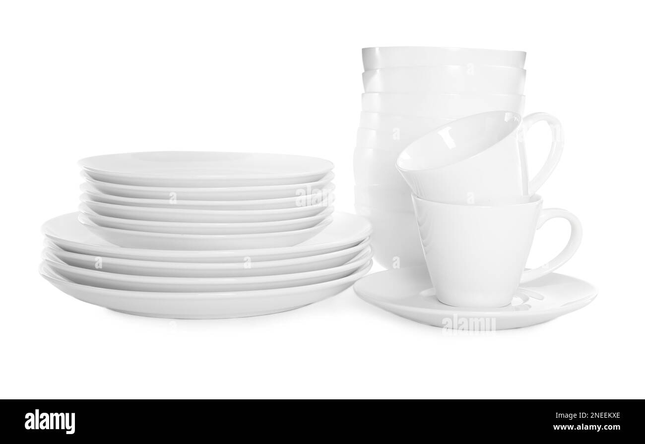 Stacked plates and cups on white background Stock Photo - Alamy