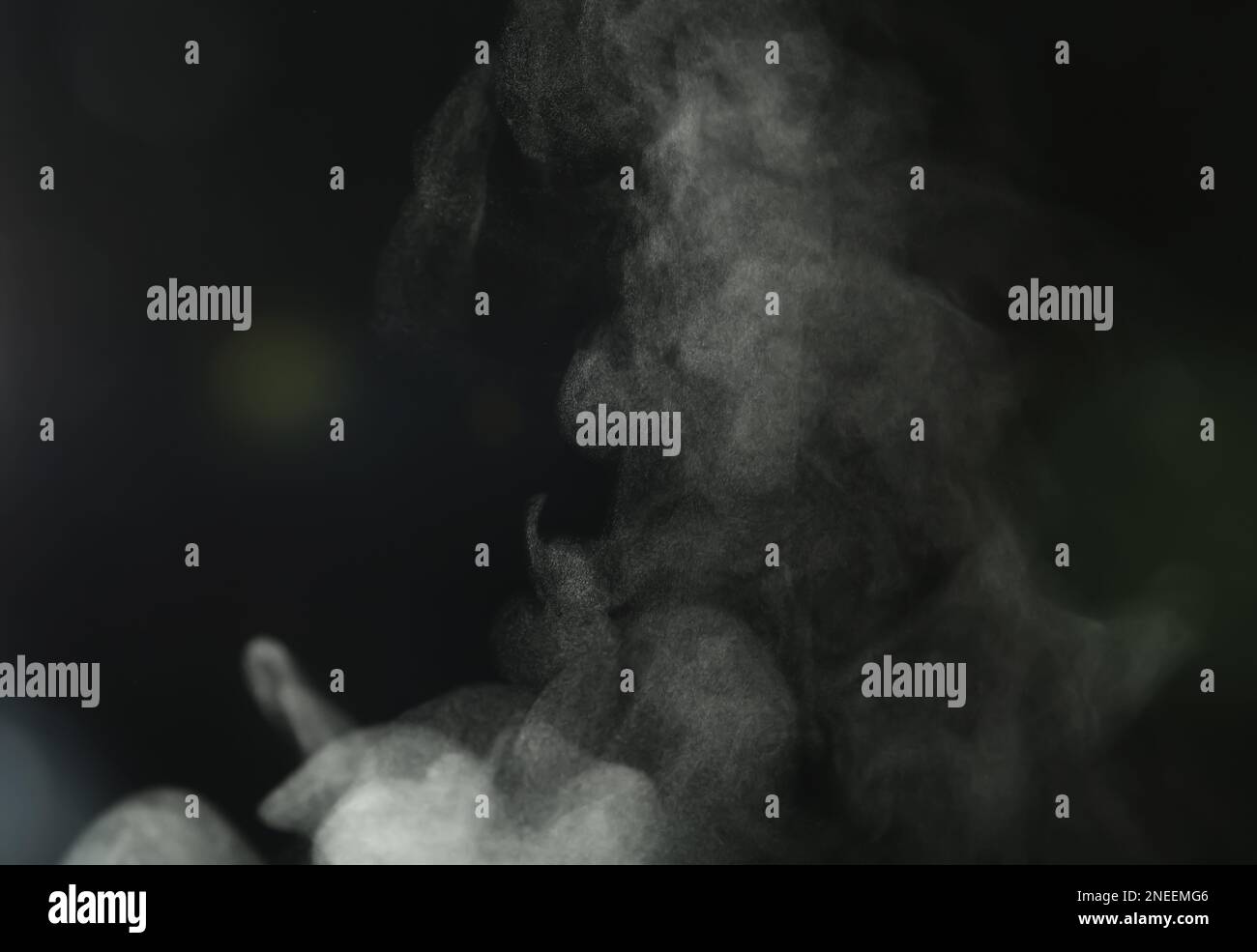 White steam in air against black background Stock Photo - Alamy