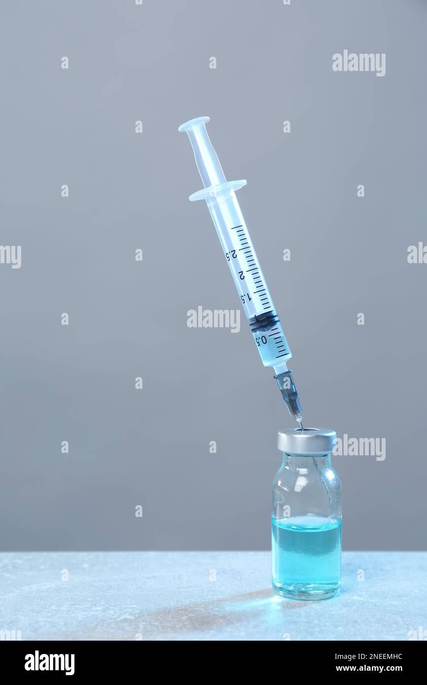 Grey medical syringe needle vial hi-res stock photography and images ...