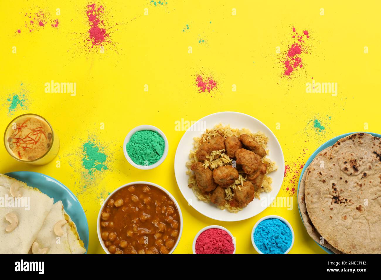 Traditional Indian food and color powders on yellow background, flat ...