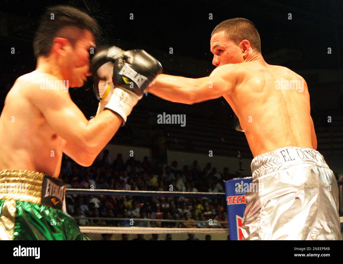 IBF light flyweight champion Brian Viloria, left, of Hawaii receives a ...