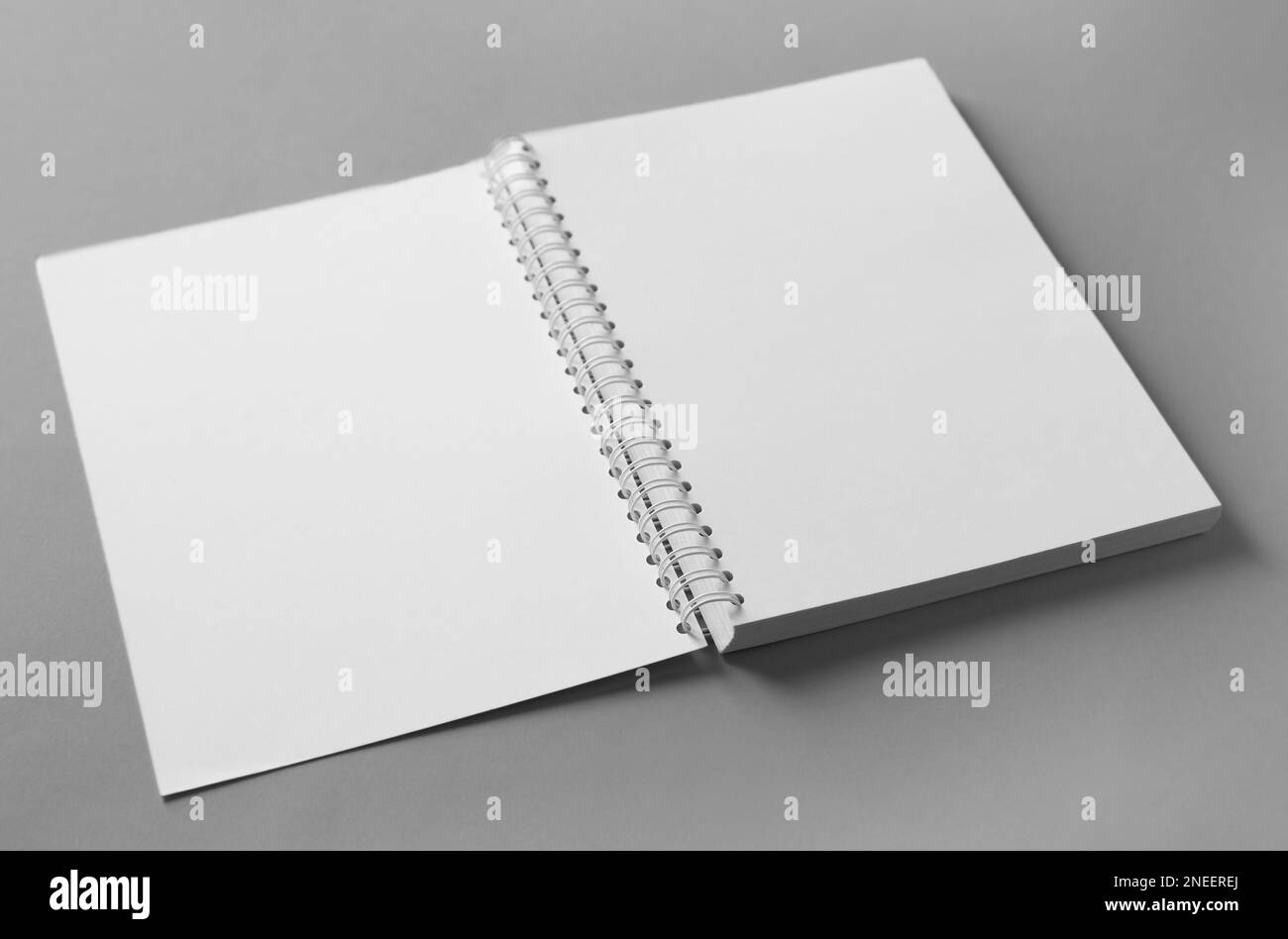 Open blank notebook on grey background. Mockup for design Stock Photo ...