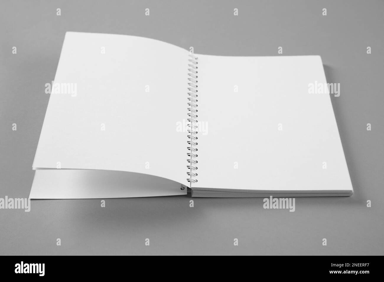 Open blank notebook on grey background. Mockup for design Stock Photo ...