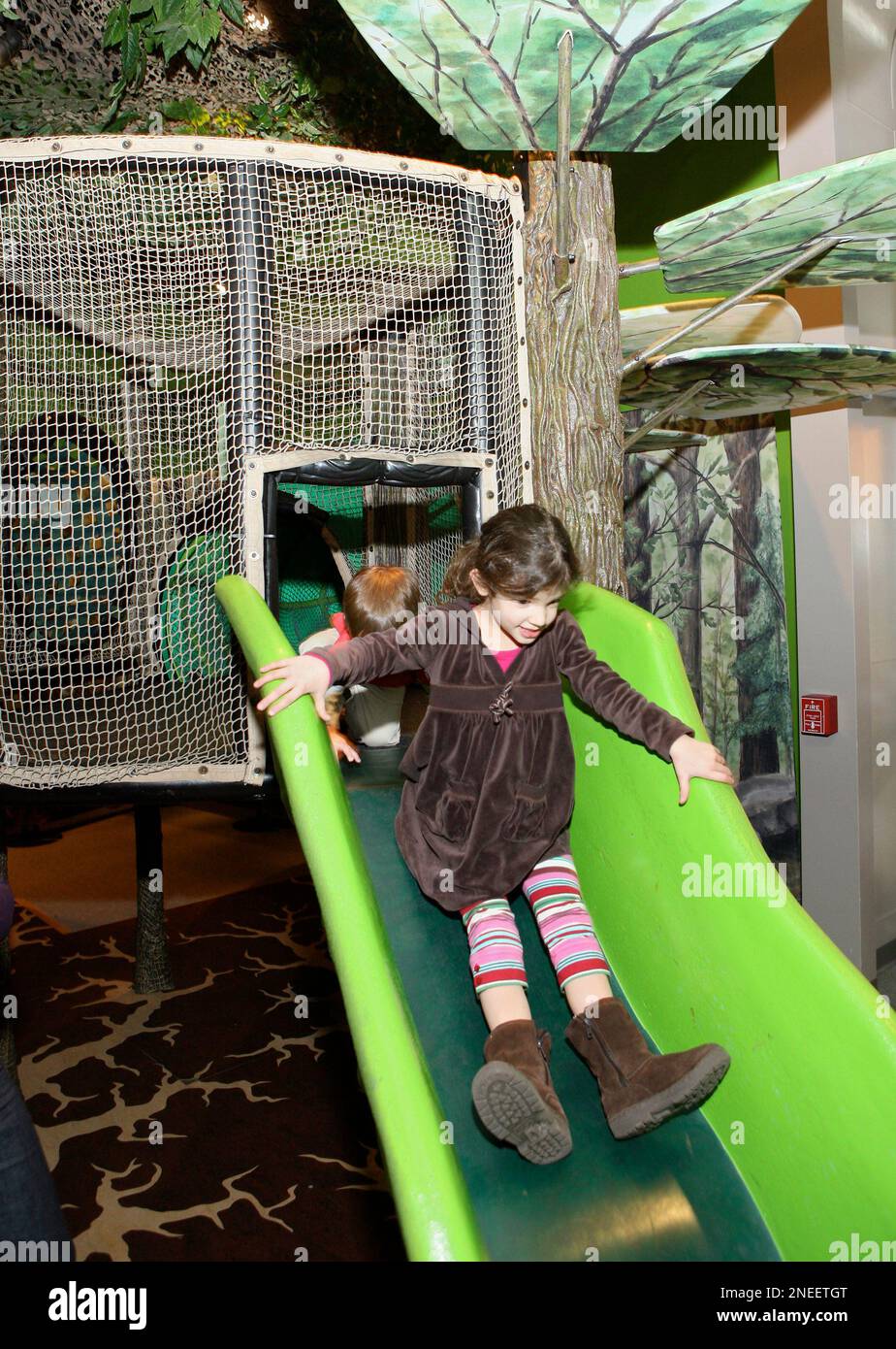 Gracie A. goes down the tree slide at Doubletree Hotels and Arbor Day ...